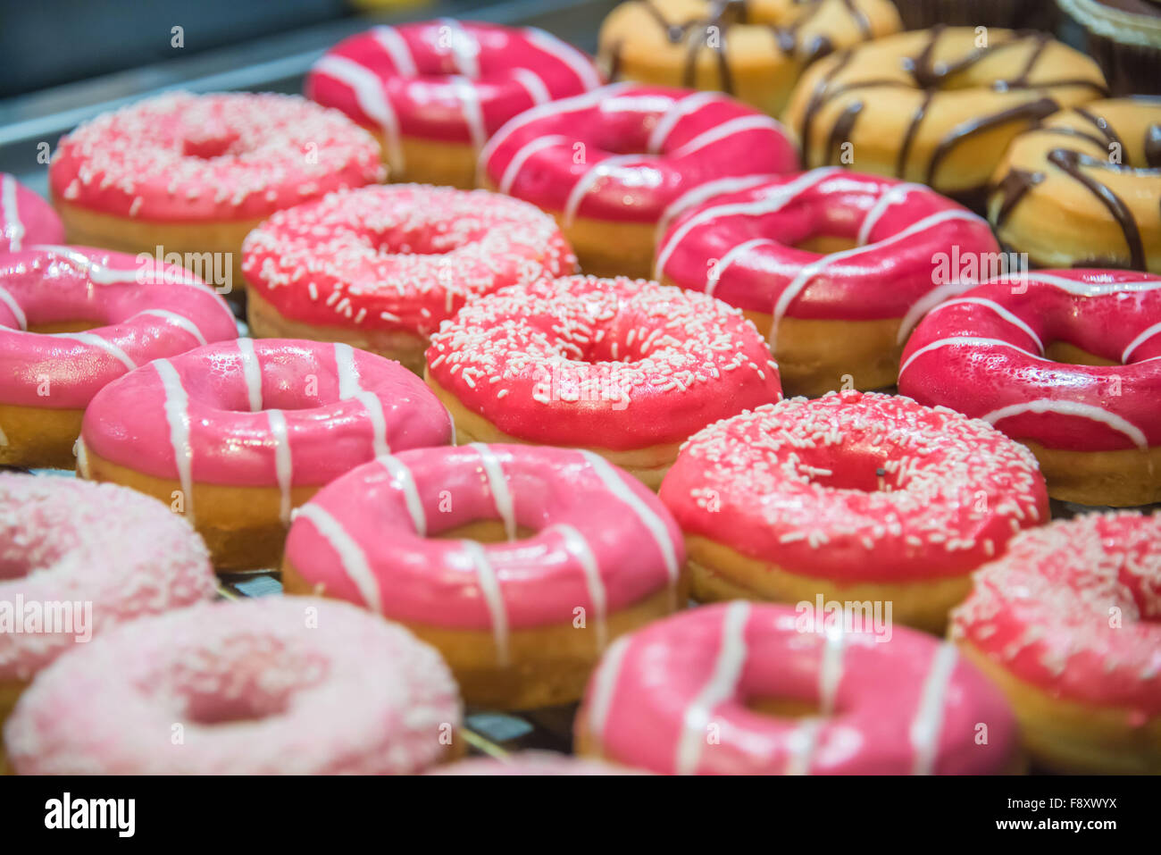 Sweet donuts arranged at display Stock Photo - Alamy