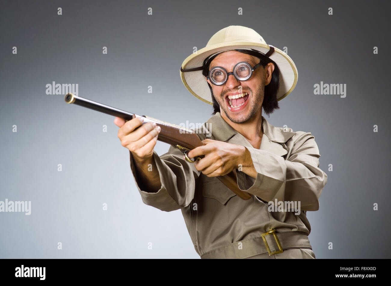 Funny safari hunter with rifle Stock Photo - Alamy