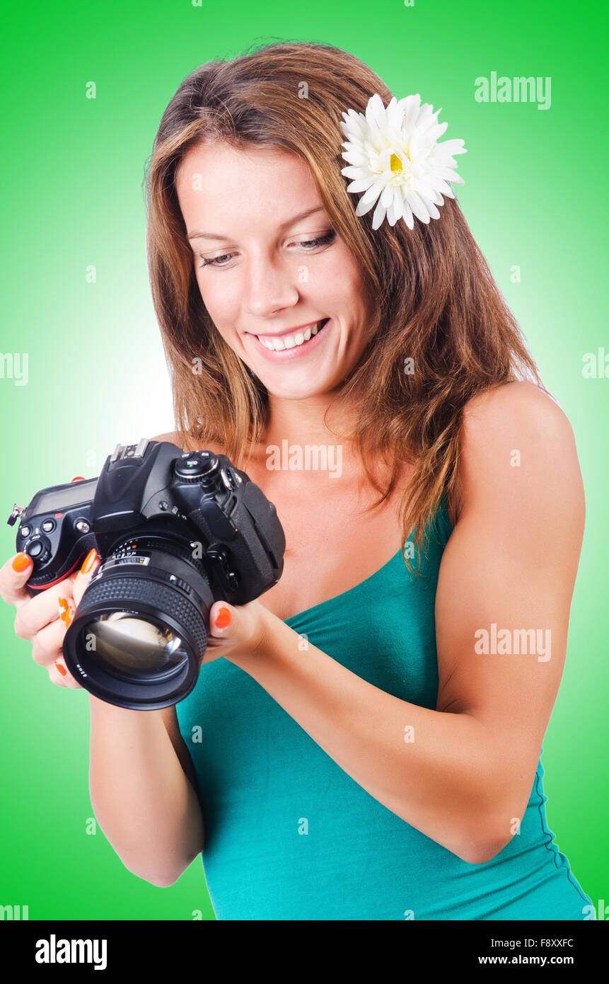 Attractive female photographer on white Stock Photo - Alamy