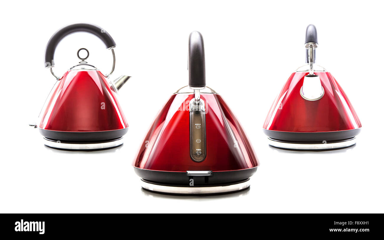 Three Red electric kettles on white background Stock Photo - Alamy