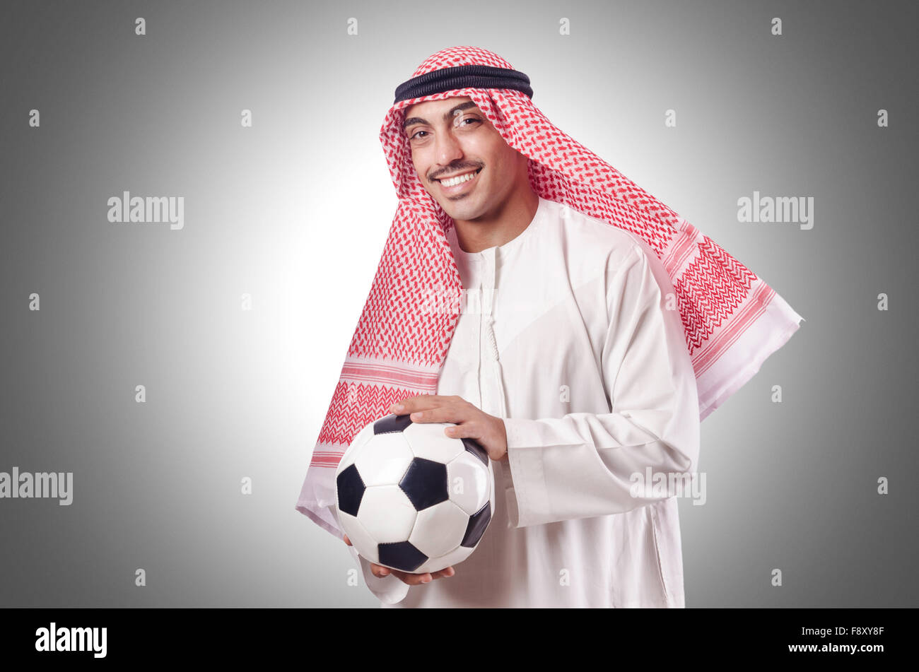 Arab man with football on white Stock Photo - Alamy