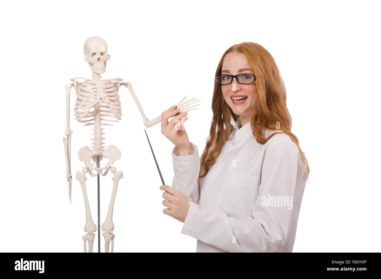 Young female doctor with skeleton isolated on white Stock Photo - Alamy