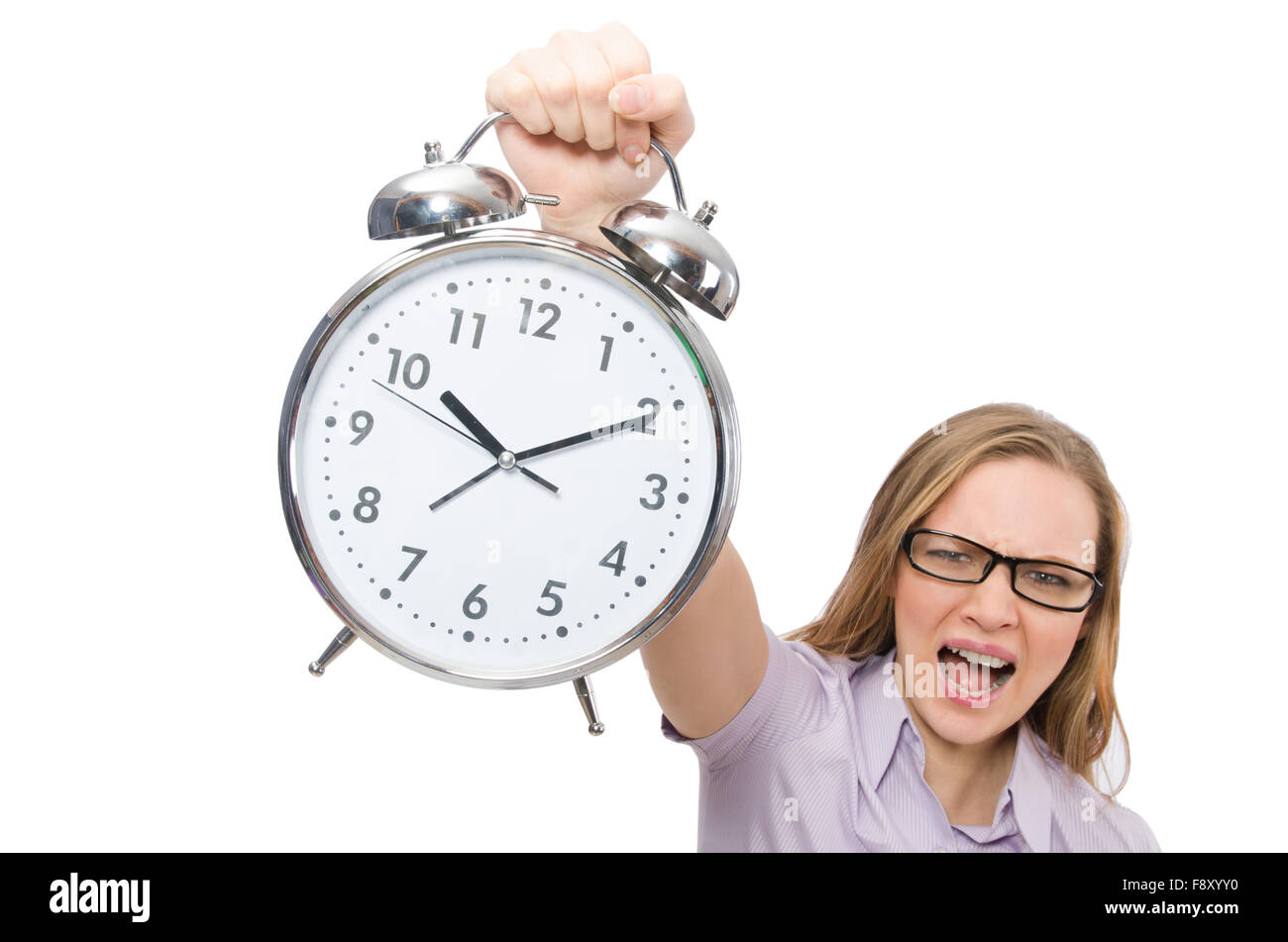Young employee holding alarm clock isolated on white Stock Photo - Alamy