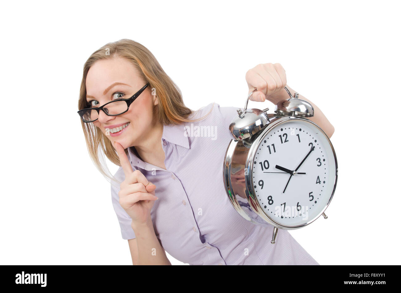 Young employee holding alarm clock isolated on white Stock Photo - Alamy