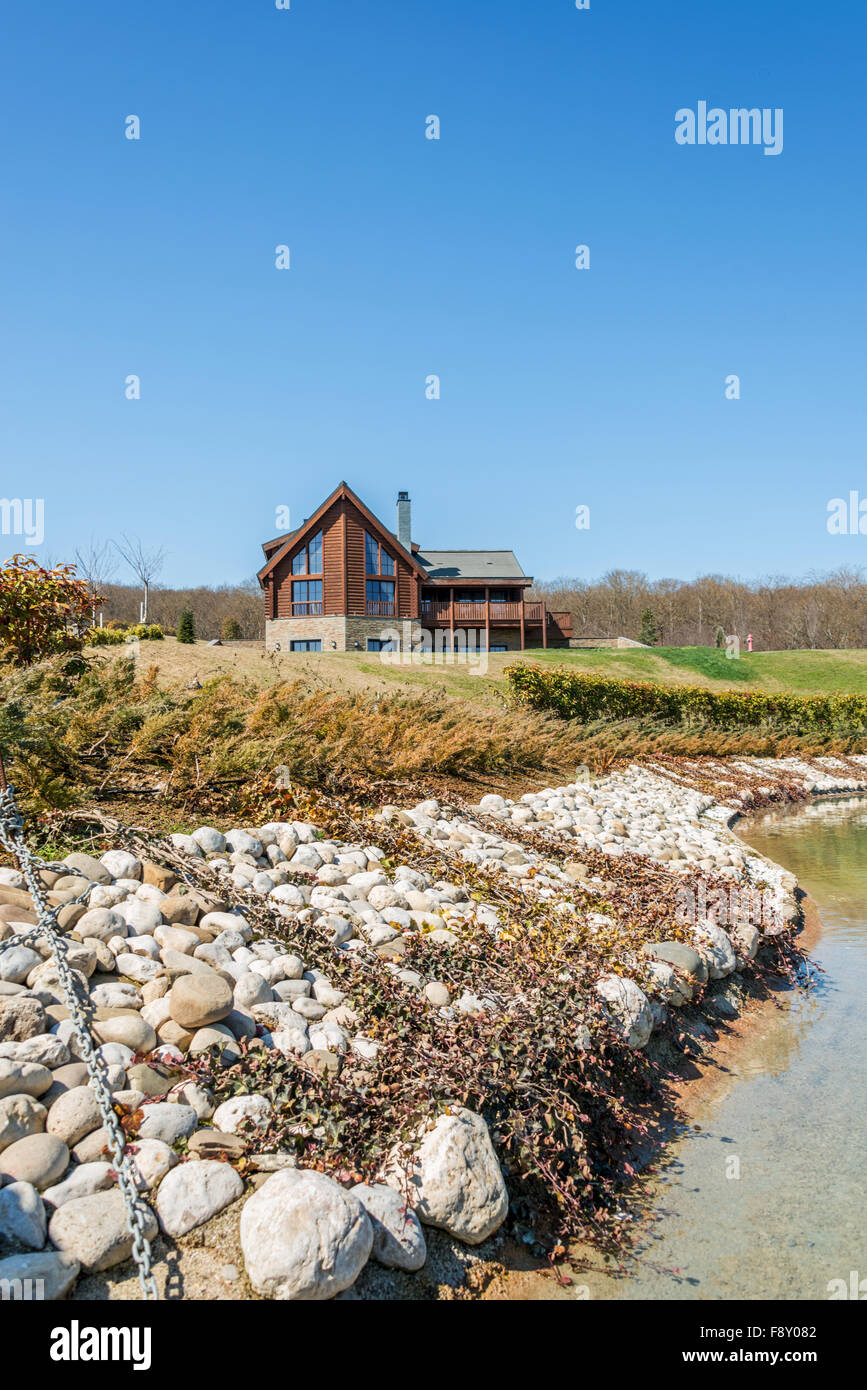 Modern house near water on bright day Stock Photo - Alamy