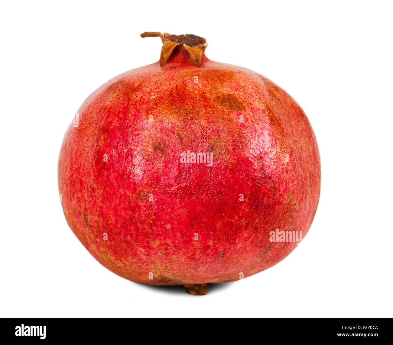 One ripe pomegranate. Isolated over white background Stock Photo - Alamy