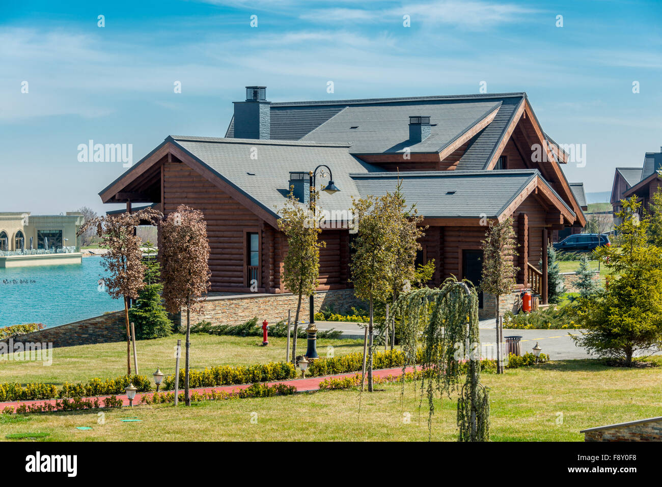 Modern house near water on bright day Stock Photo - Alamy