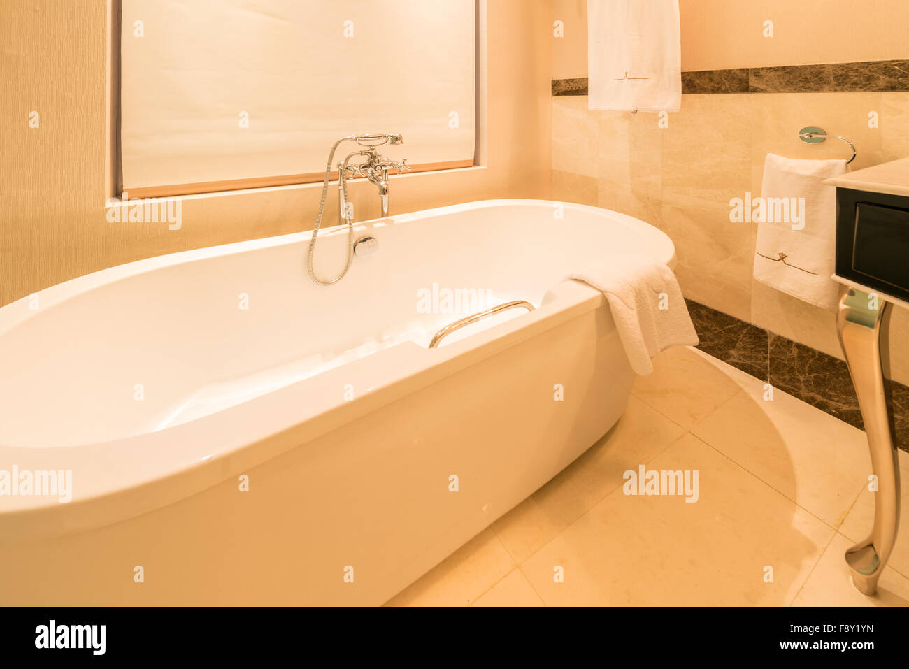 Modern bathroom interior with bathtub Stock Photo - Alamy