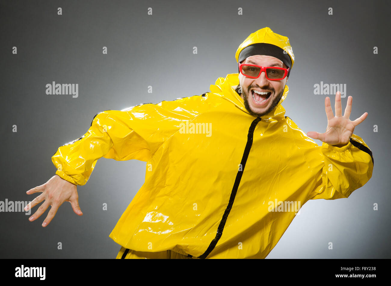 Funny man wearing yellow suit Stock Photo - Alamy