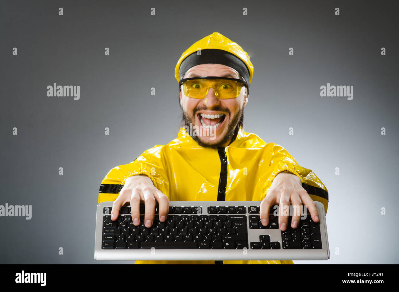 Man wearing yellow suit with keyboard Stock Photo - Alamy