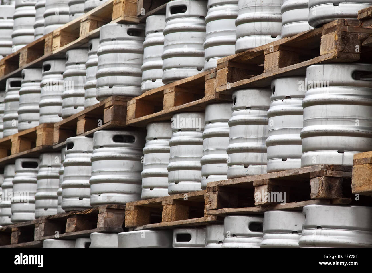 Many metal kegs of beer in regular rows Stock Photo - Alamy