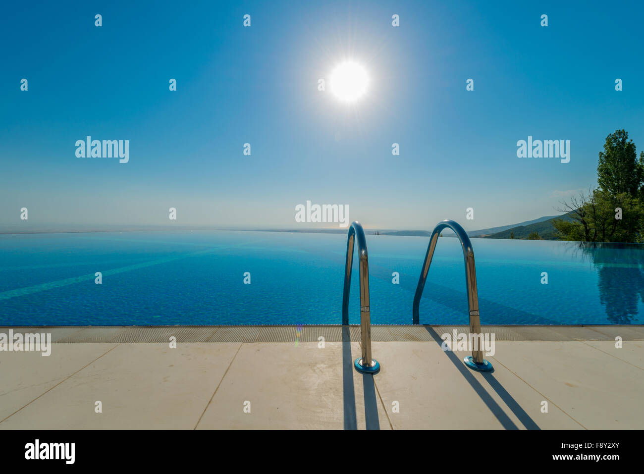 Infinity pool on the bright summer day Stock Photo - Alamy