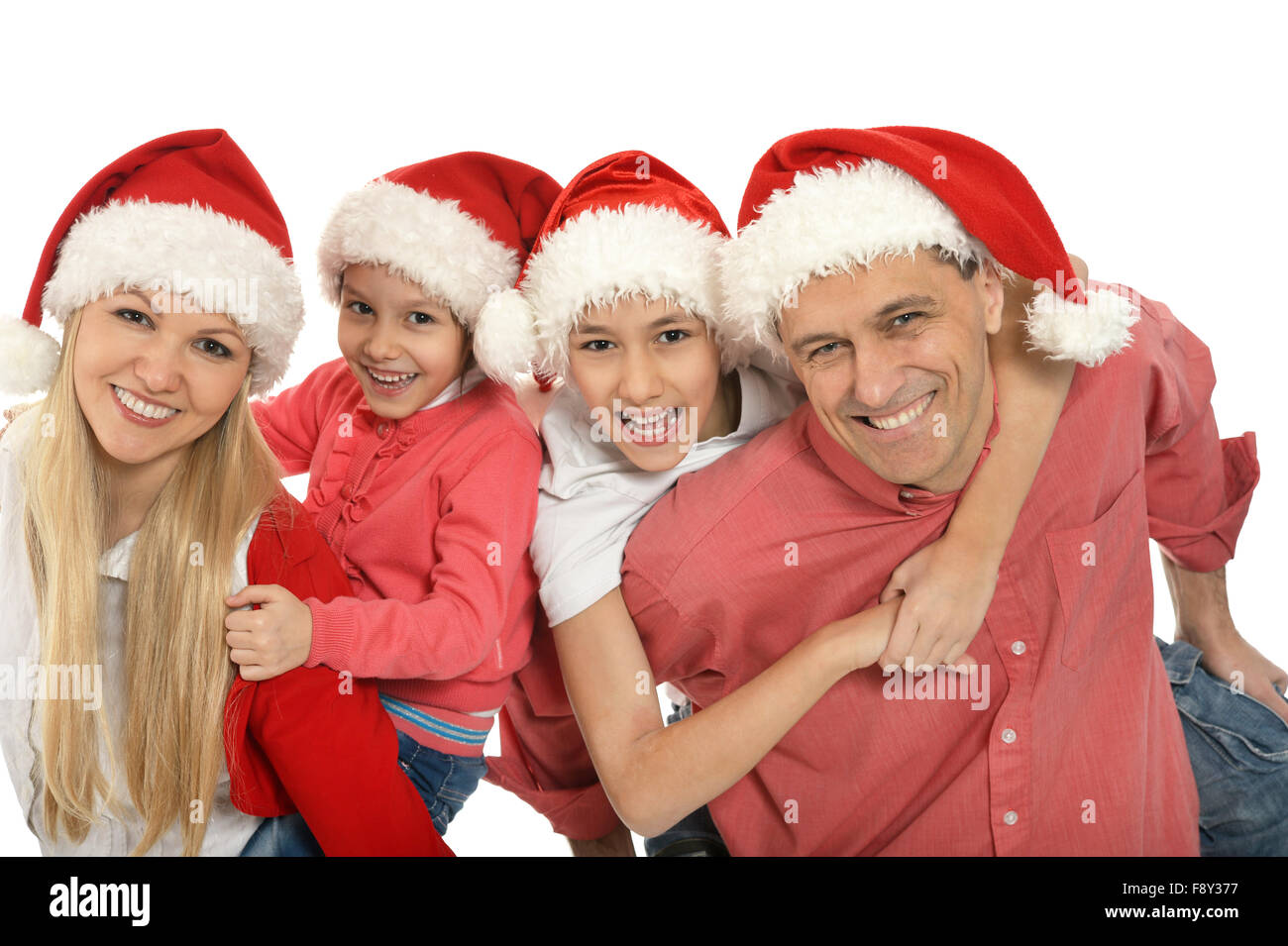 family wearing Christmas holiday caps Stock Photo - Alamy