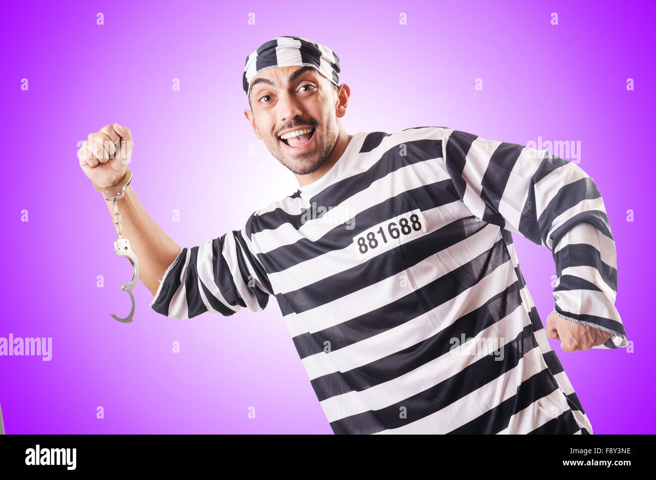 Convict criminal in striped uniform Stock Photo - Alamy