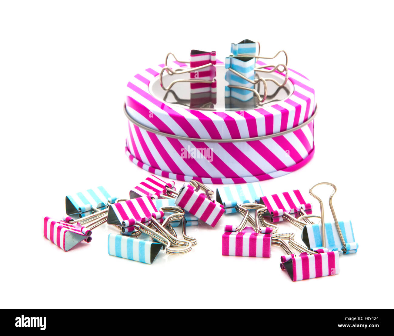 Stripey Tin with foldback clip's of a white background Stock Photo - Alamy