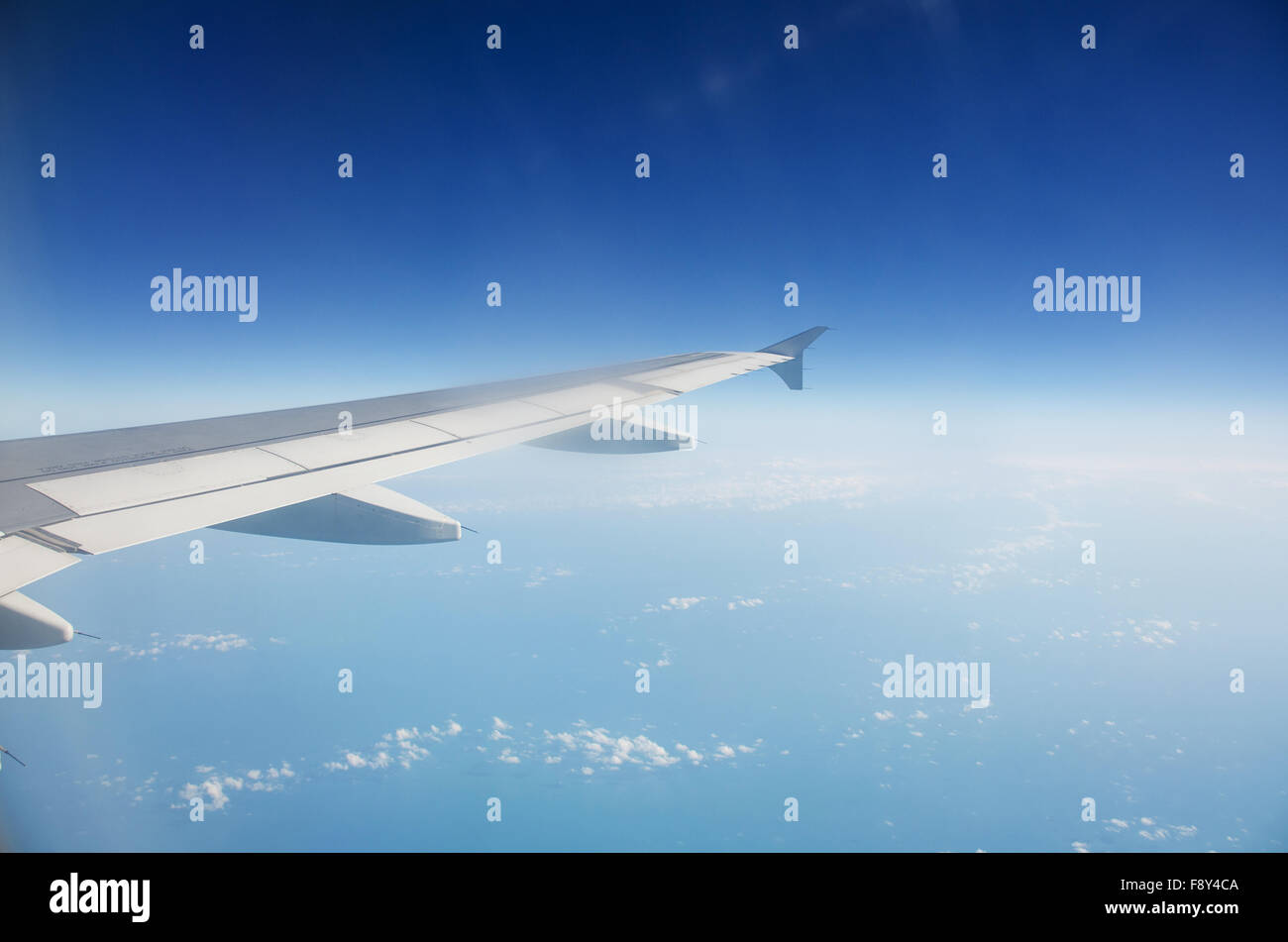 Airplane wing out of window Stock Photo - Alamy