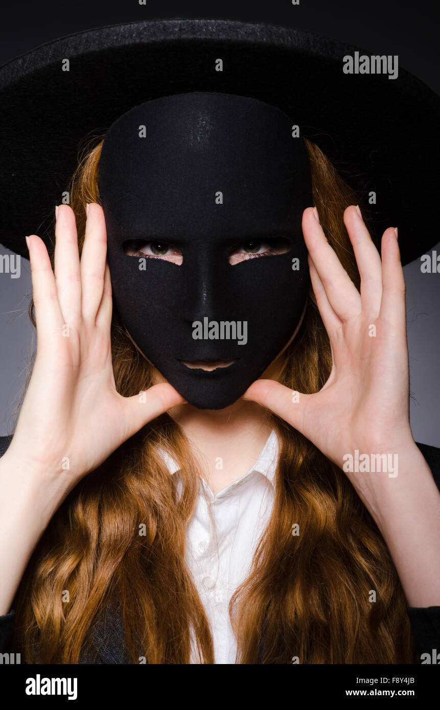 Woman with mask in hypocrisy concept Stock Photo - Alamy