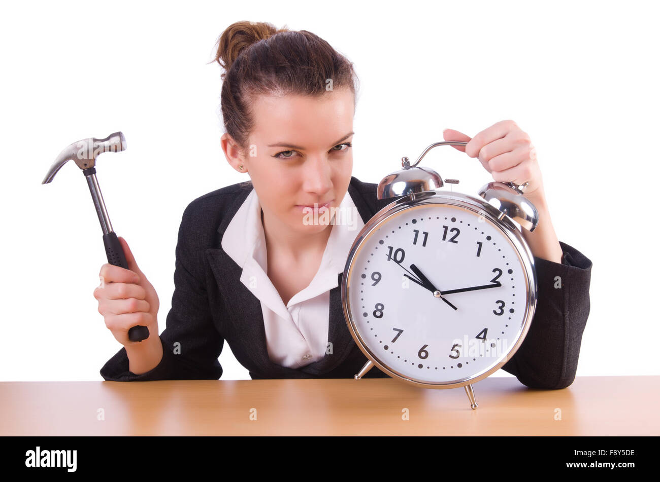 Woman trying to break the clock Stock Photo - Alamy