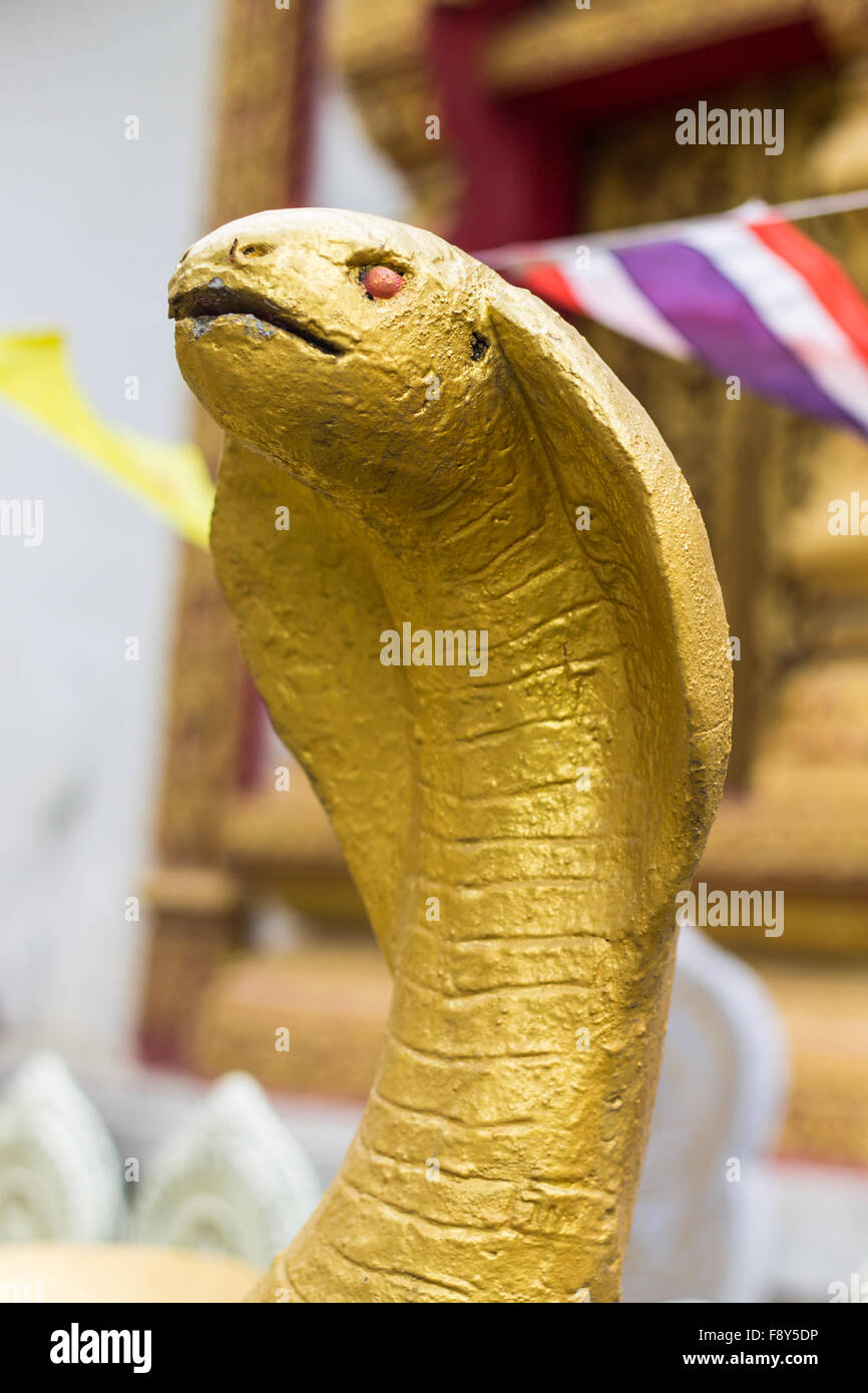 The statue of the yellow snake in Thai temple Stock Photo - Alamy