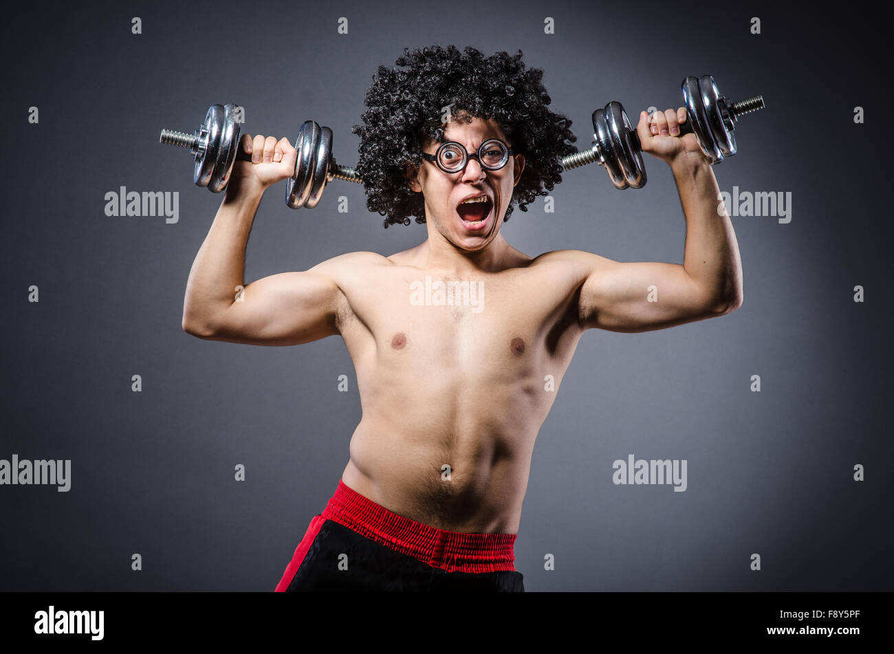Comic athlete dumbbells young funny hi-res stock photography and images ...