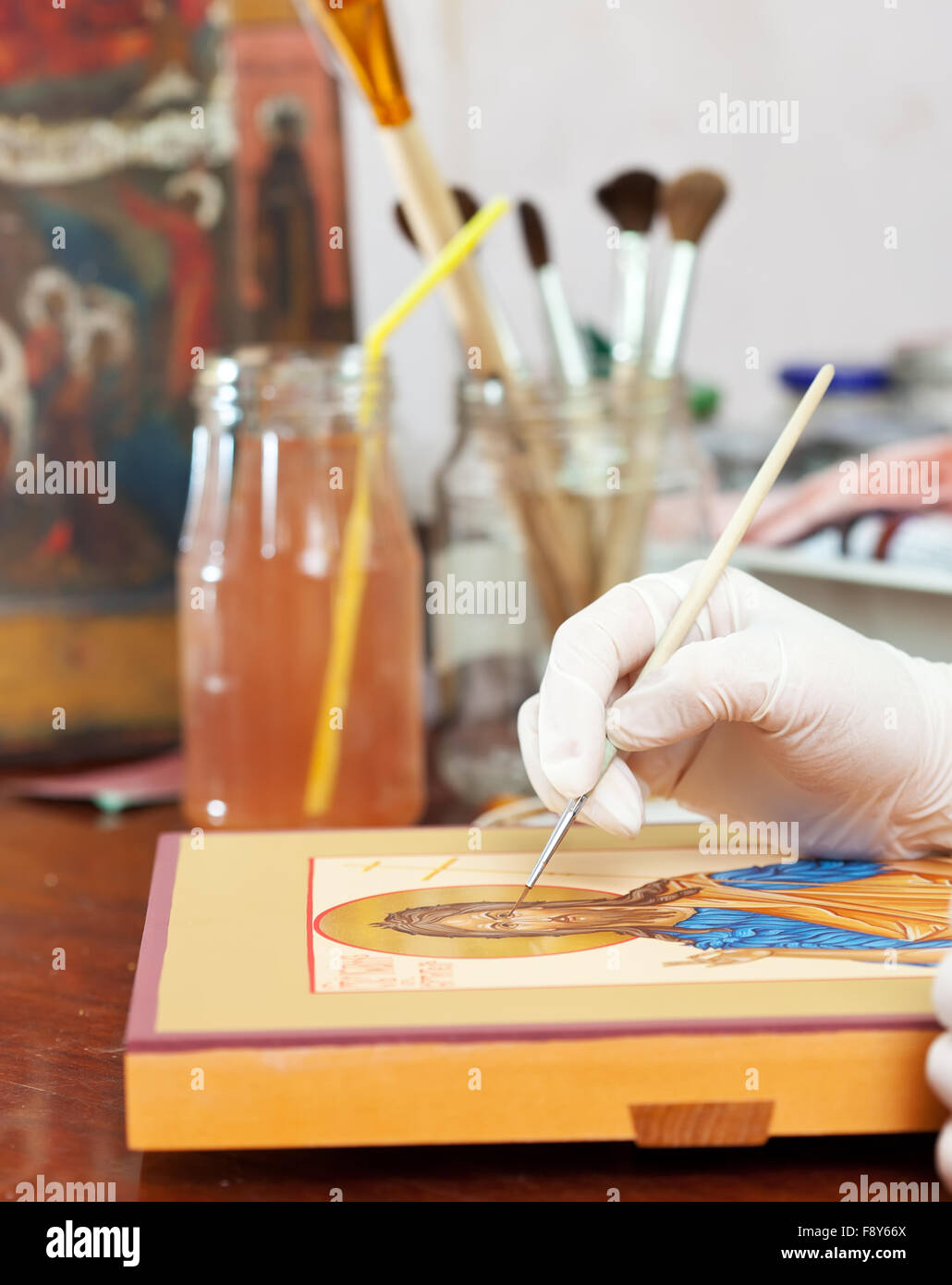 Artist paints of Christian icon at icon-painting workshop Stock Photo ...