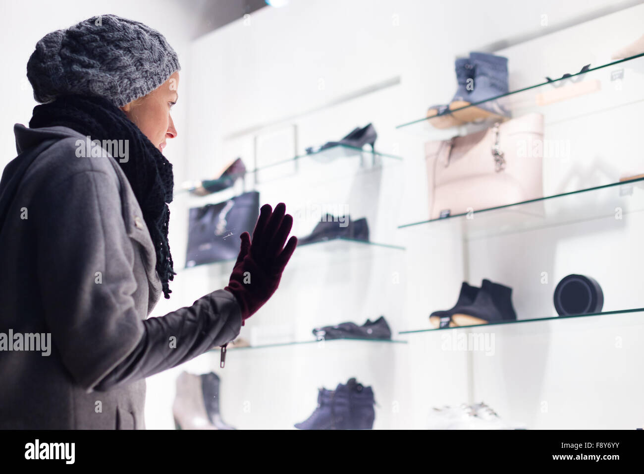 Woman window shopping Stock Photo - Alamy