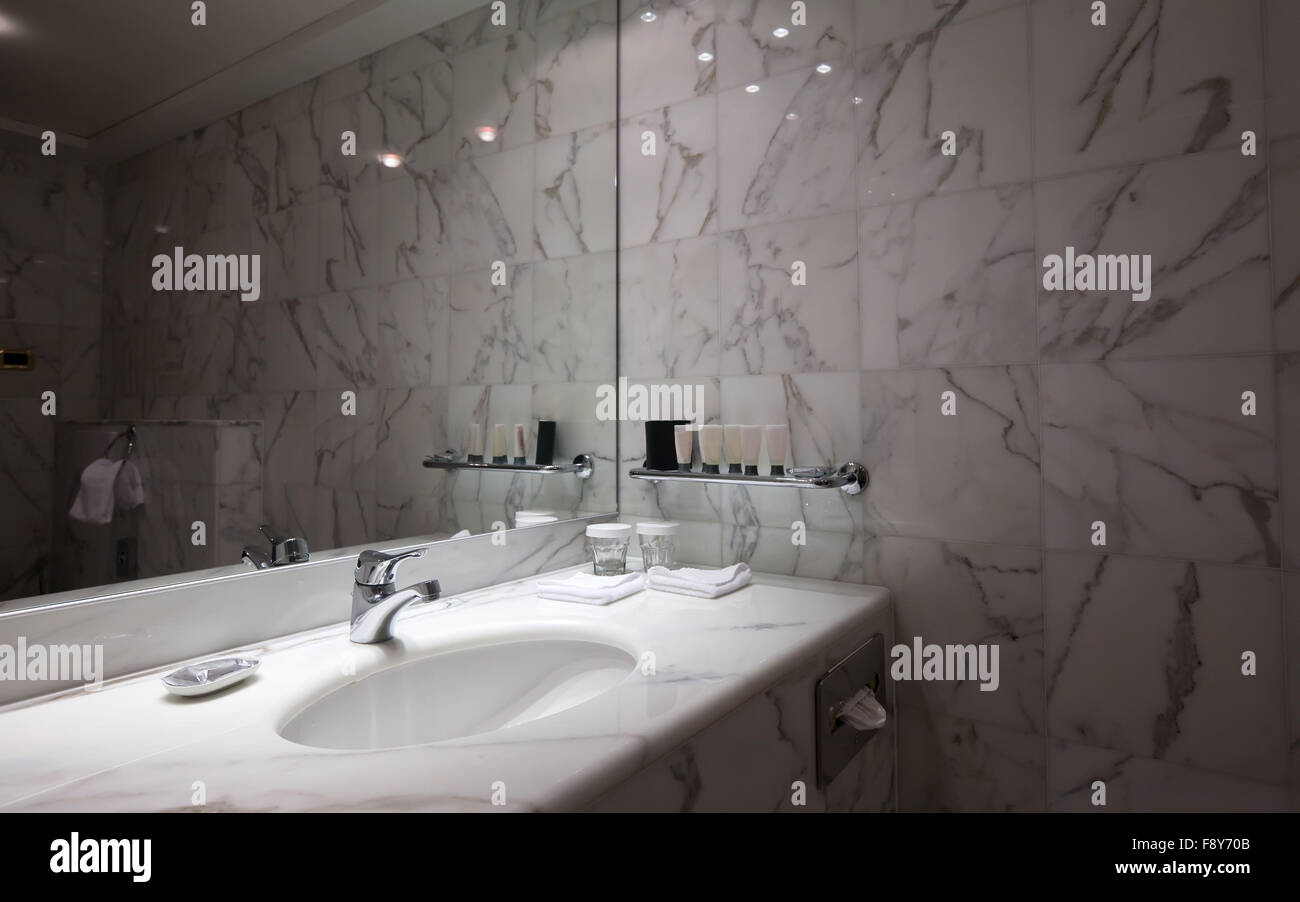 Marble sink in toilet with mirror Stock Photo - Alamy