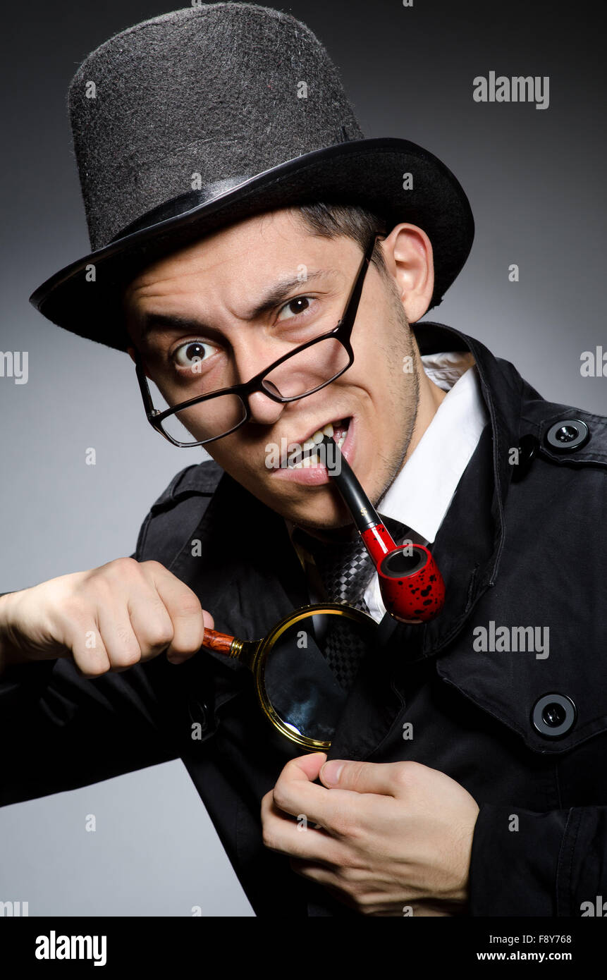 Funny detective with pipe and hat Stock Photo - Alamy