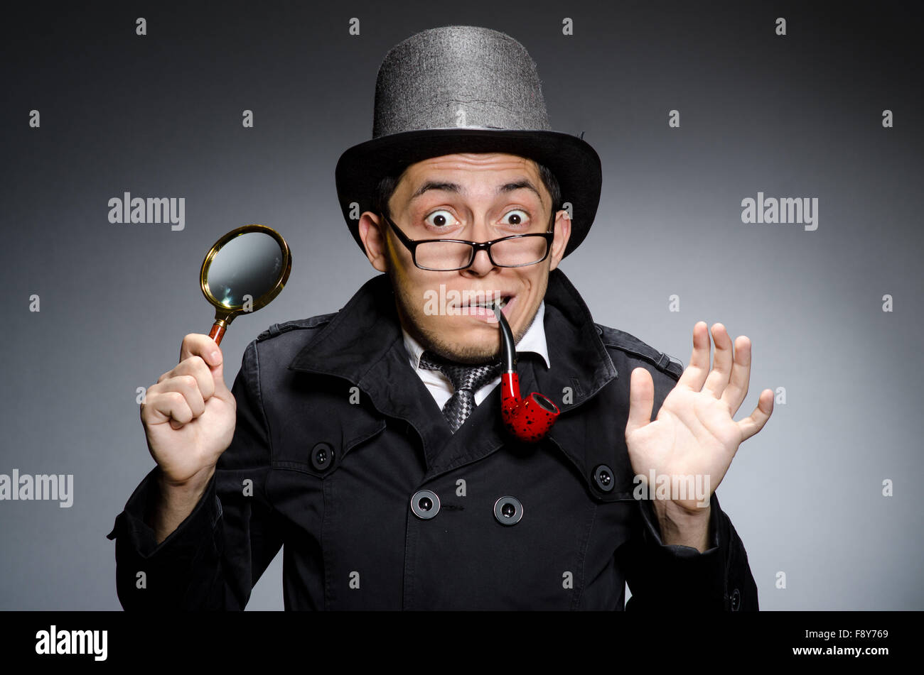 Funny detective with pipe and hat Stock Photo - Alamy