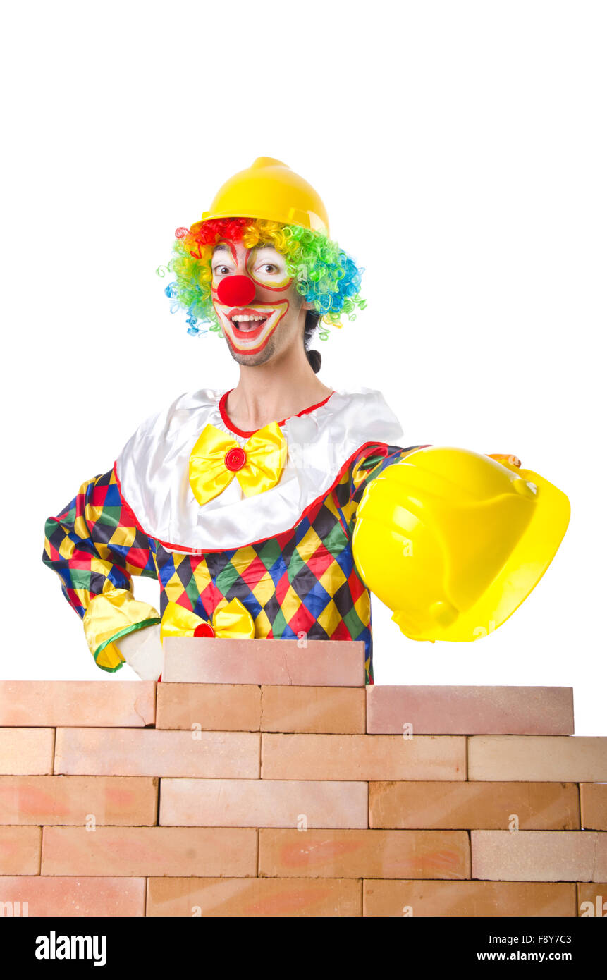 Bad construction concept with clown laying bricks Stock Photo - Alamy