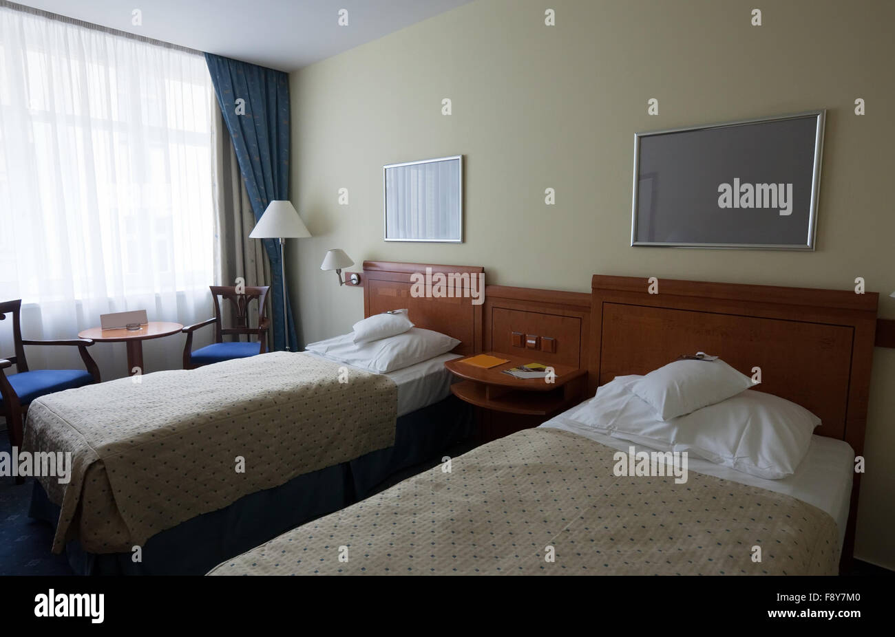 interior of simple bedroom with two bed Stock Photo - Alamy