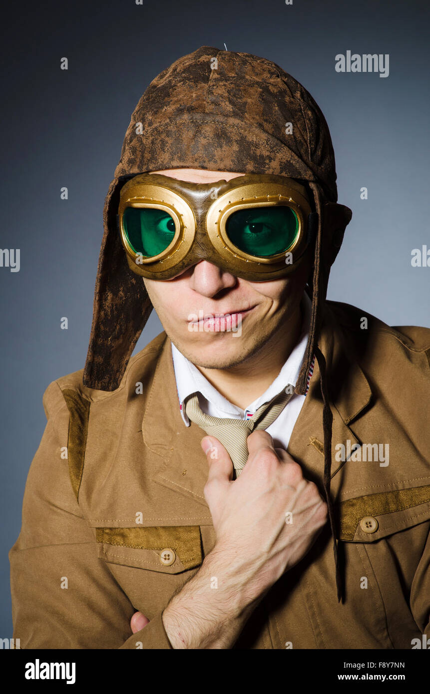 Funny pilot with goggles and helmet Stock Photo - Alamy