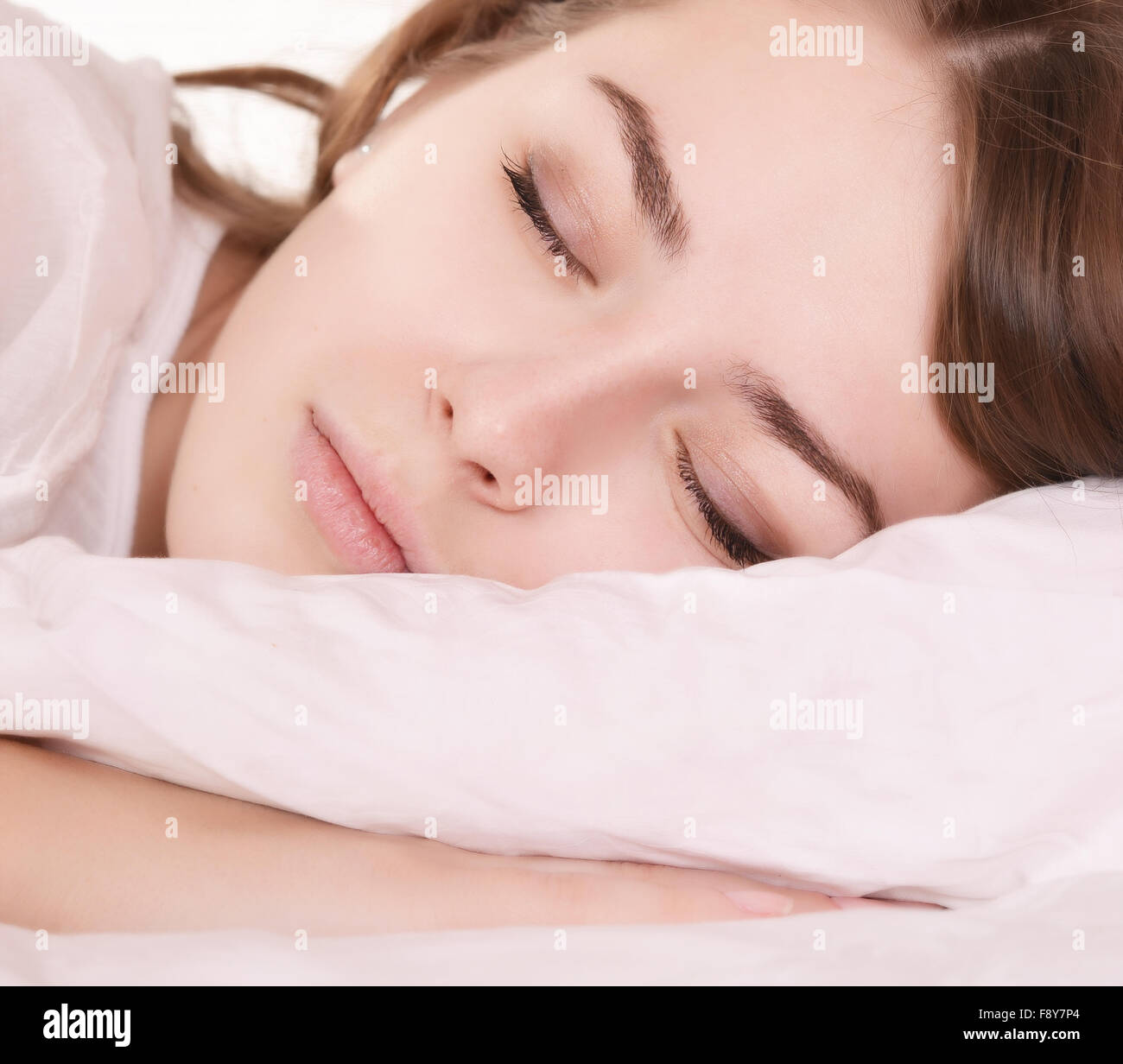 Beautiful woman sleeping in bed hi-res stock photography and images - Alamy