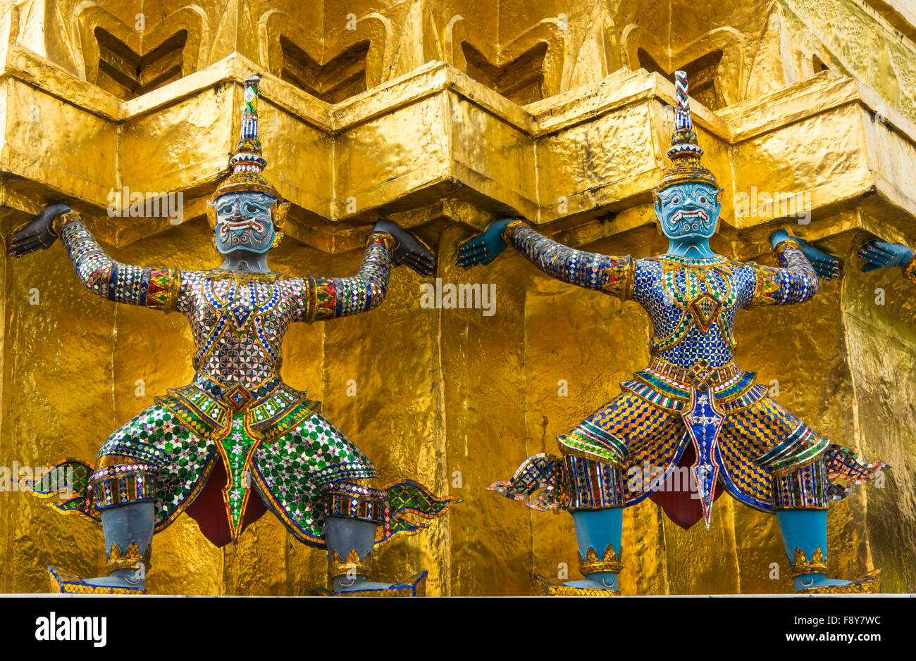 The demon statue supporting golden pagoda on Grand Palace, Temple of ...