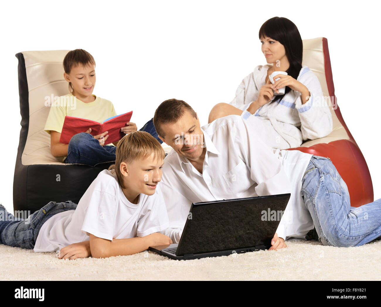 Happy family with laptop Stock Photo - Alamy