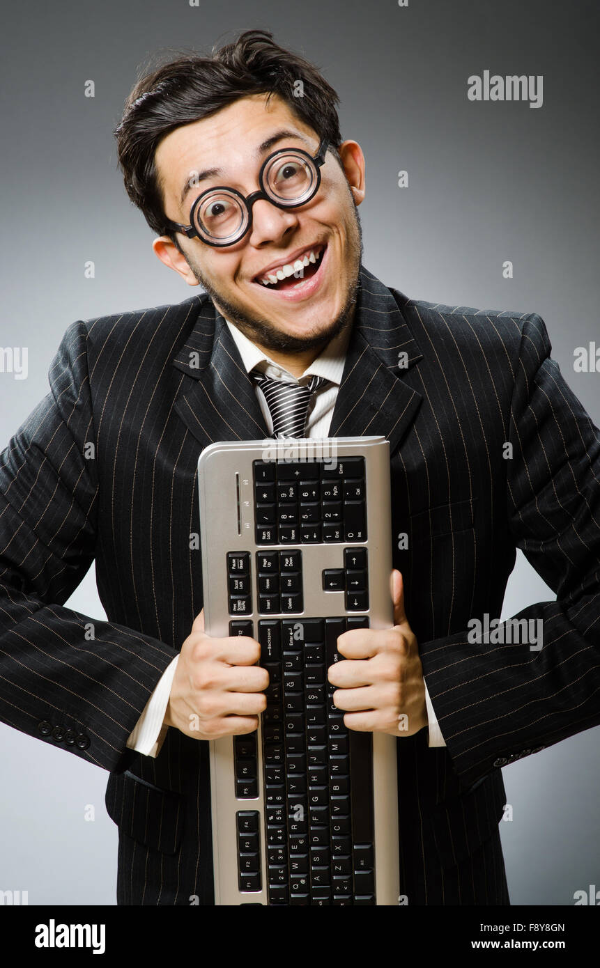 Comouter geek with computer keyboard Stock Photo - Alamy