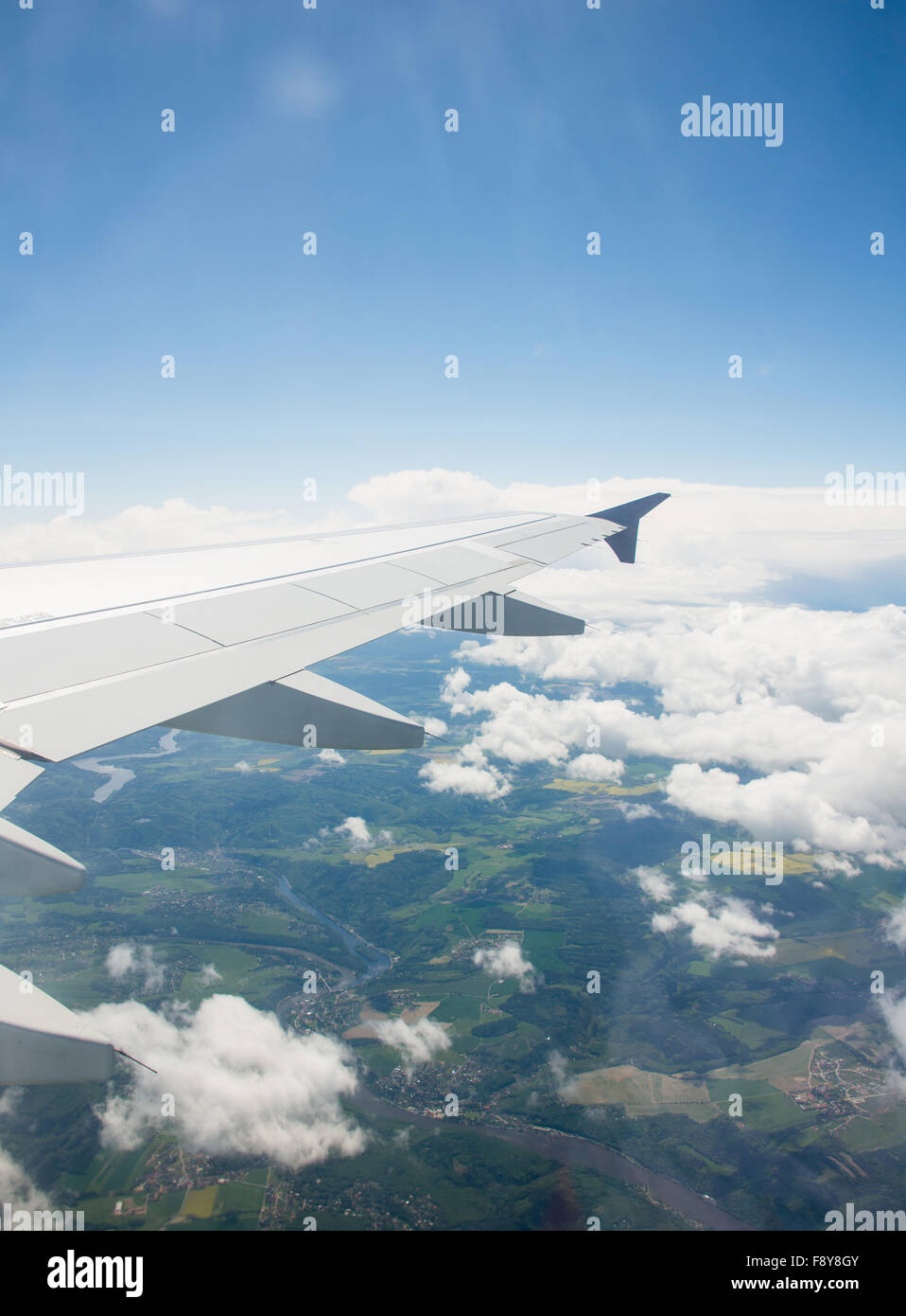 Airplane wing out of window Stock Photo - Alamy