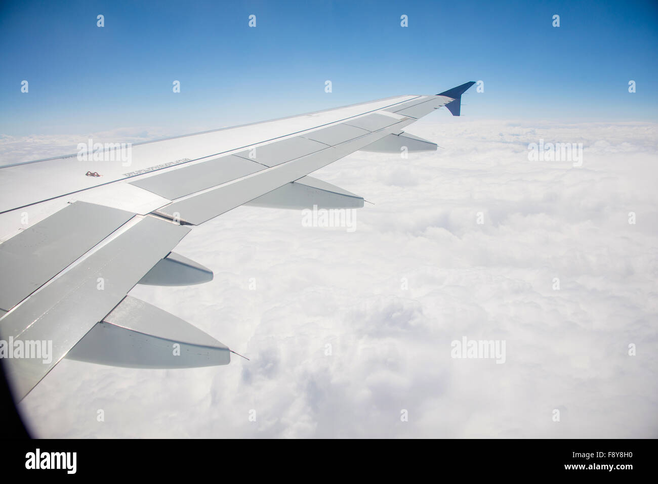 Airplane wing out of window Stock Photo - Alamy