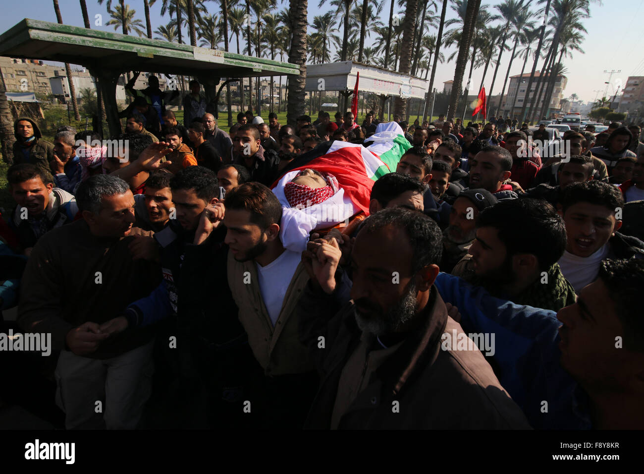 Gaza. 12th Dec, 2015. Mourners carry the body of Palestinian Sami Madi ...