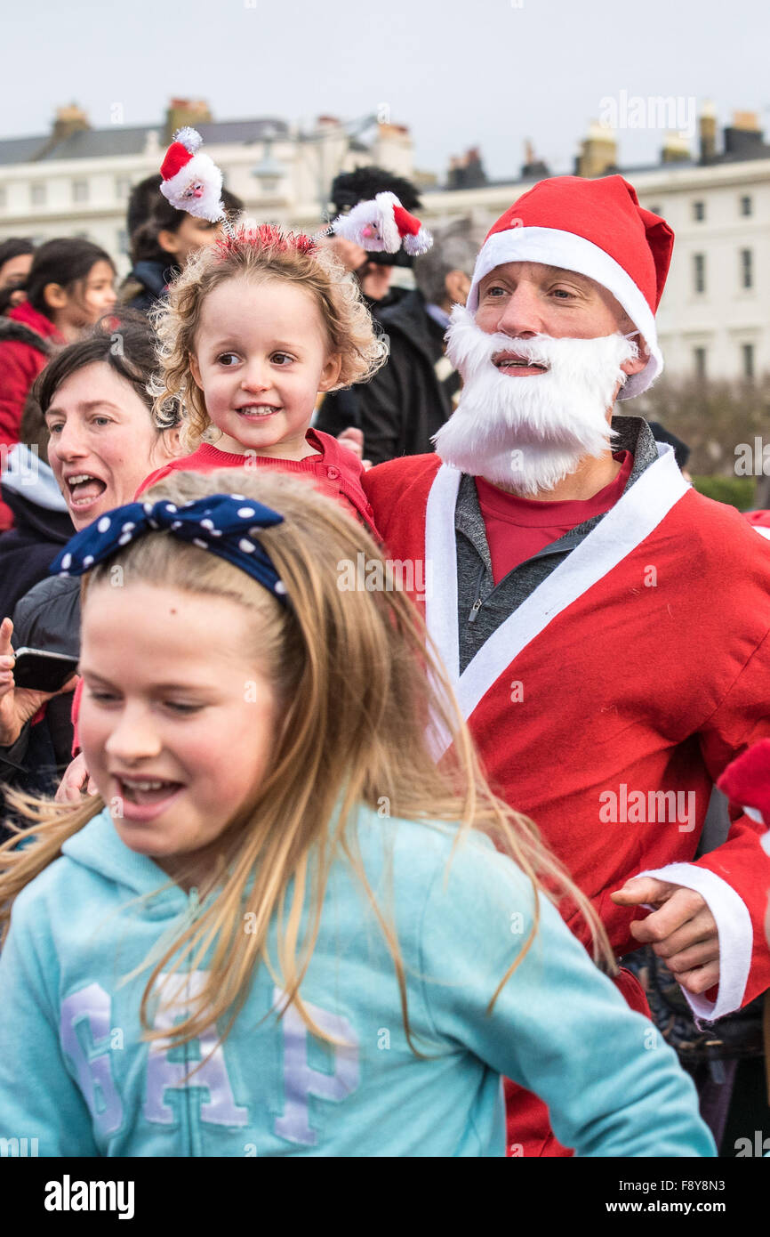Brighton, East Sussex, UK. 12th December, 2015. Children and parents take part in the Santa Dash ...