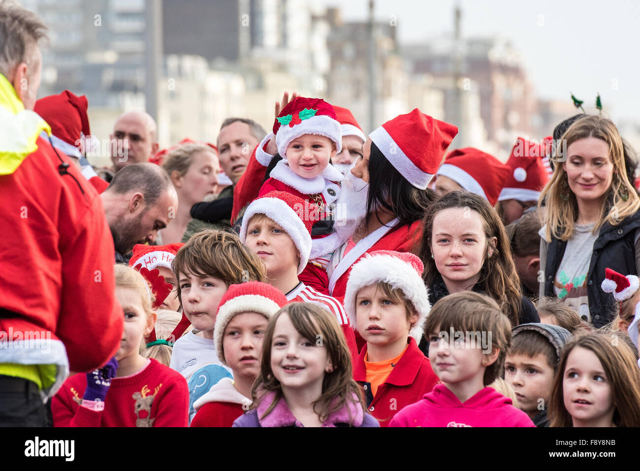 Brighton, East Sussex, UK. 12th December, 2015. Children and parents take part in the Santa Dash ...