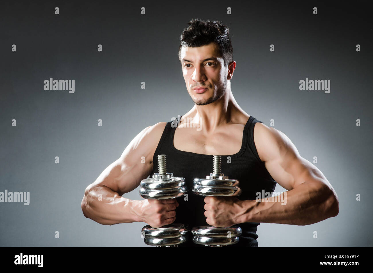 Muscular ripped bodybuilder with dumbbells Stock Photo - Alamy