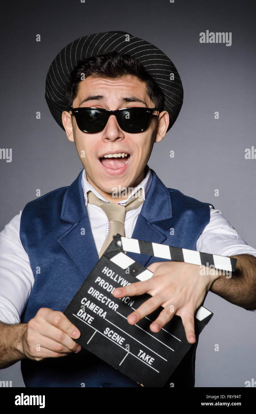 Funny man with movie clapper Stock Photo - Alamy