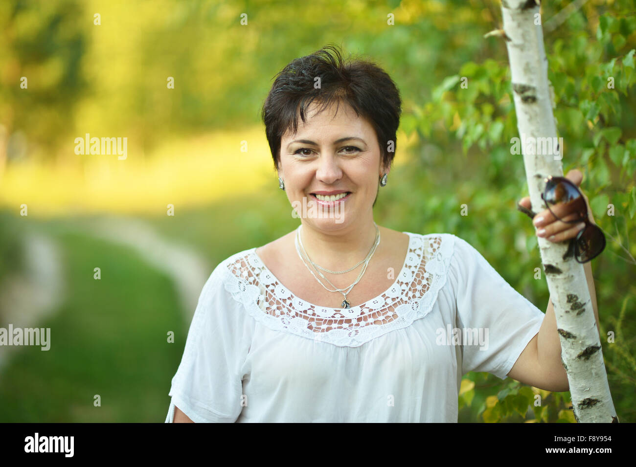 Lady enjoying summer outdoors Stock Photo - Alamy