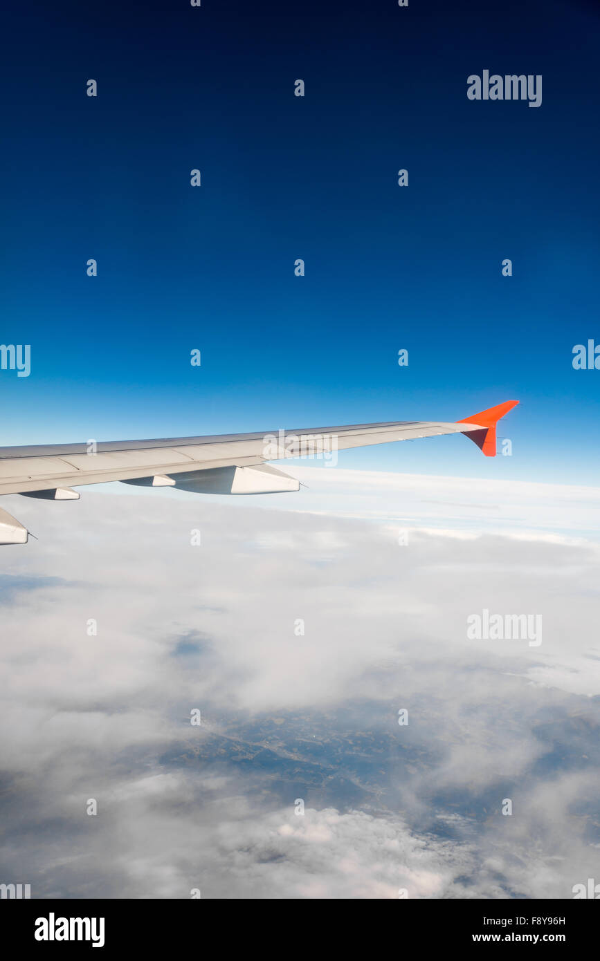 Airplane wing out of window Stock Photo - Alamy