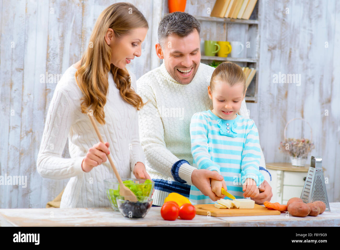 Happy family cooking together Stock Photo - Alamy