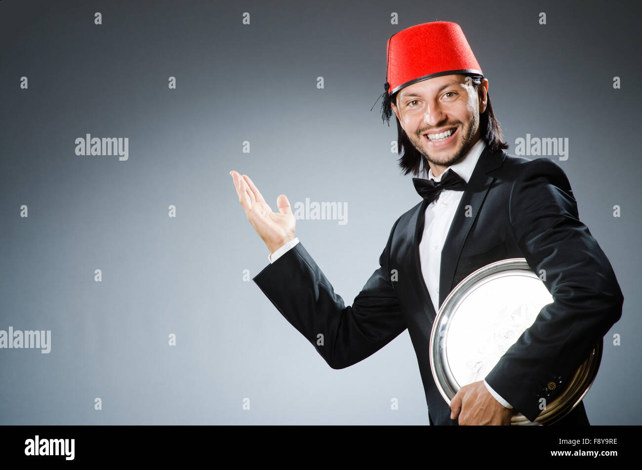 Waiter wearing traditional turkish hat Stock Photo - Alamy