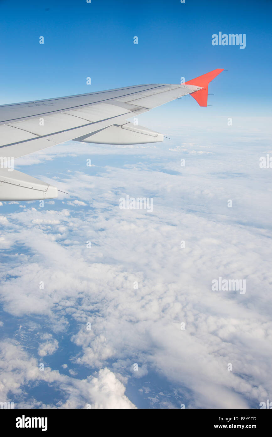 Airplane wing out of window Stock Photo - Alamy