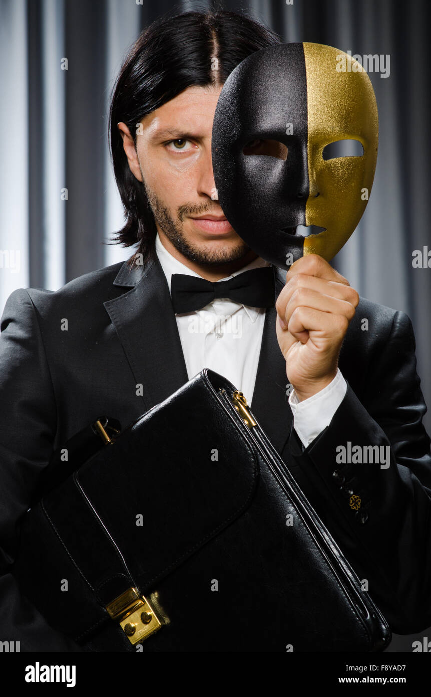 Funny concept with theatrical mask Stock Photo - Alamy