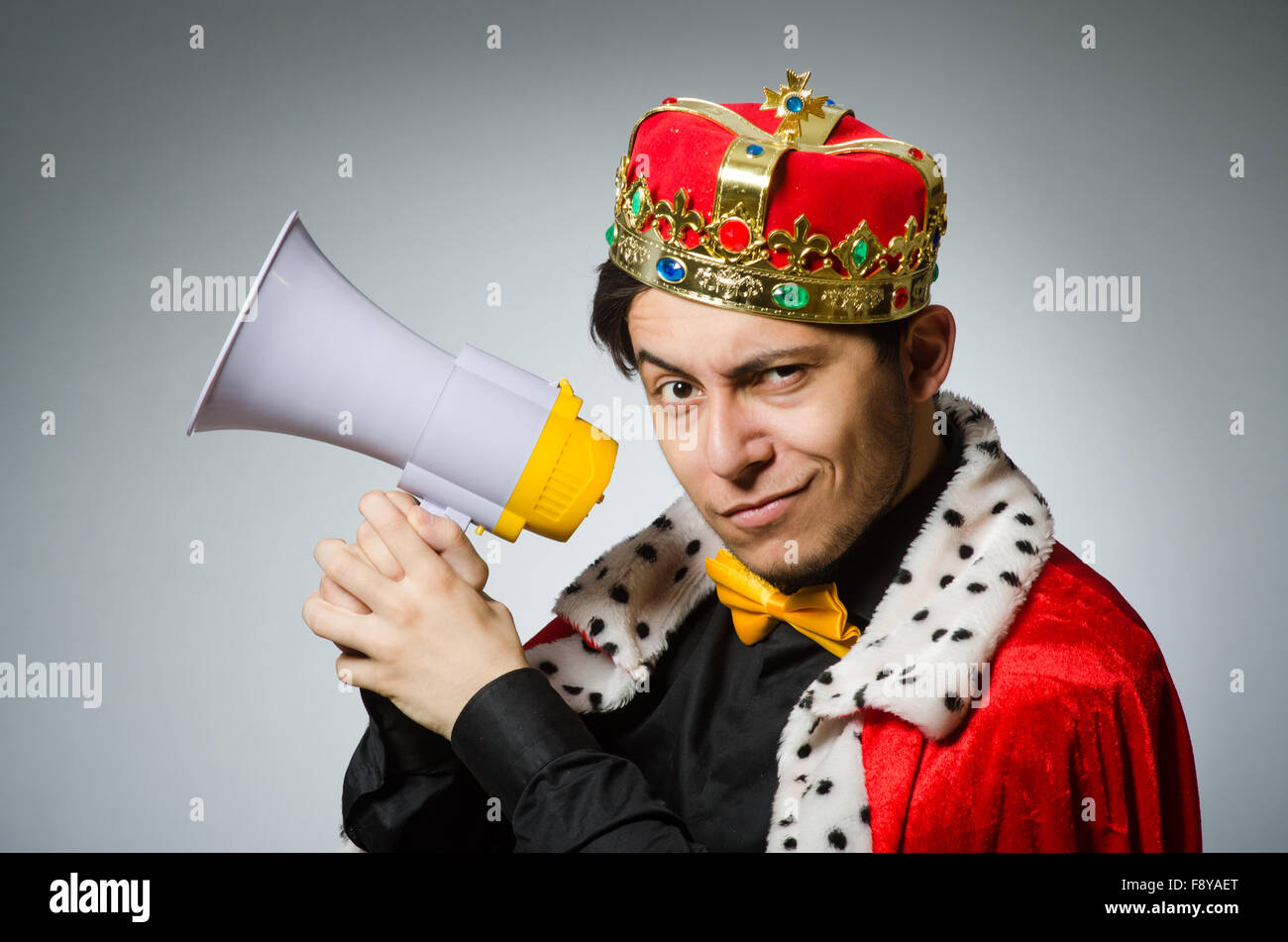 Concept with funny man wearing crown Stock Photo - Alamy